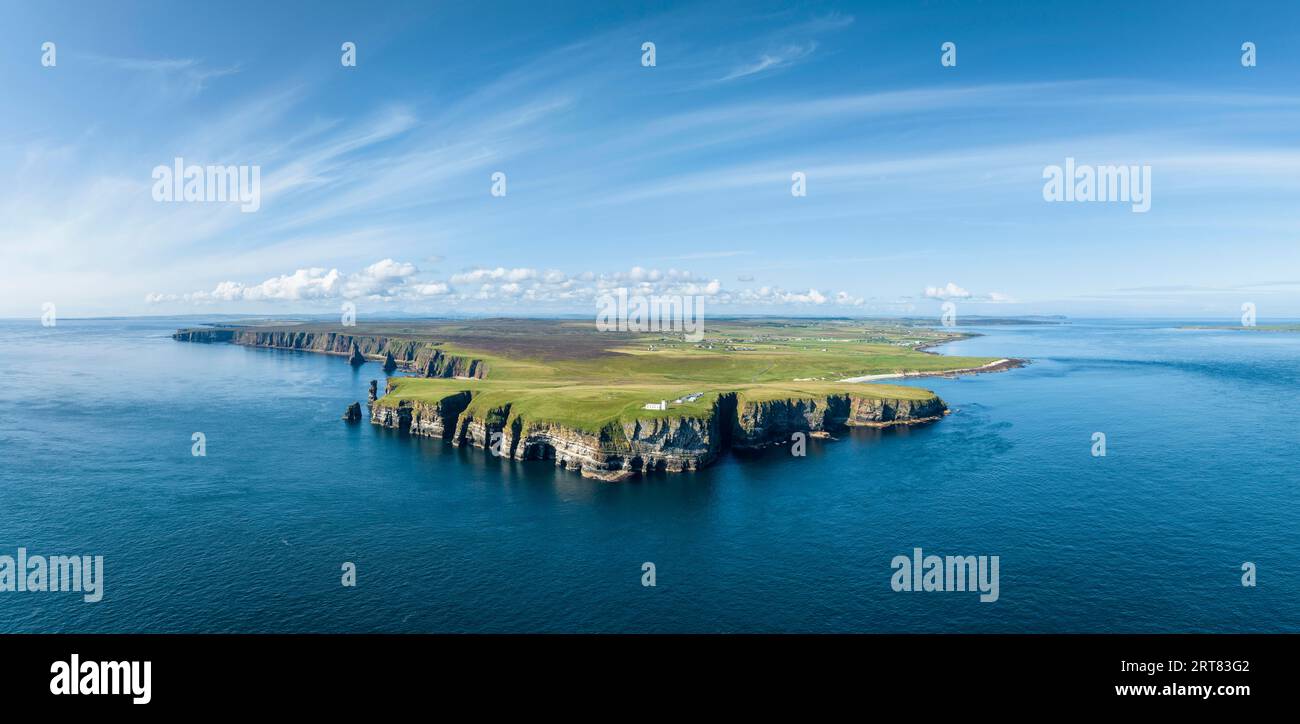 Aerial panorama of the rugged coastal landscape at Duncansby Head with ...