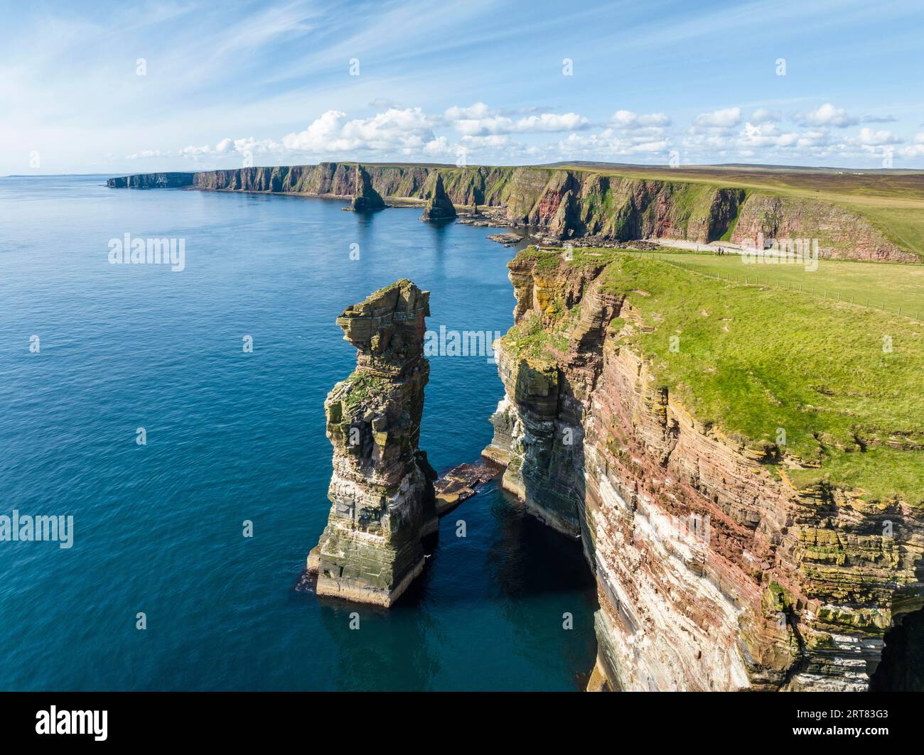 Aerial view of the rugged coastal landscape at Duncansby Head with rock ...