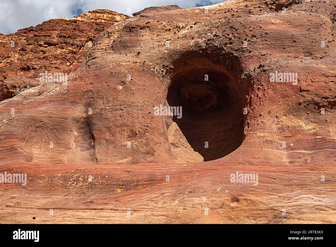 View of the caves and dwellings carved into the sandstone rock. Petra ...