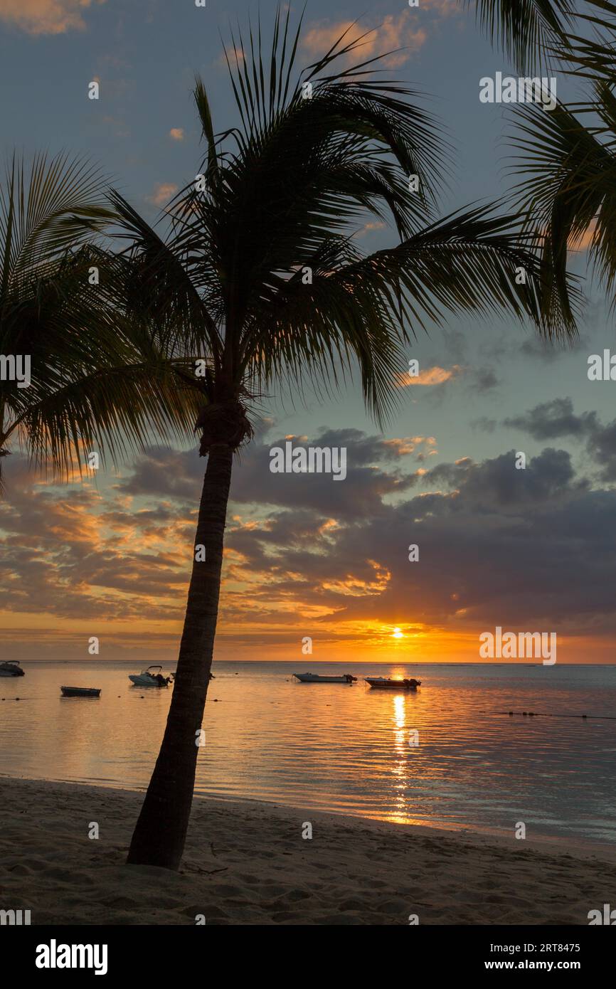 Sunset on the beach in Le Morne, Mauritius Stock Photo - Alamy