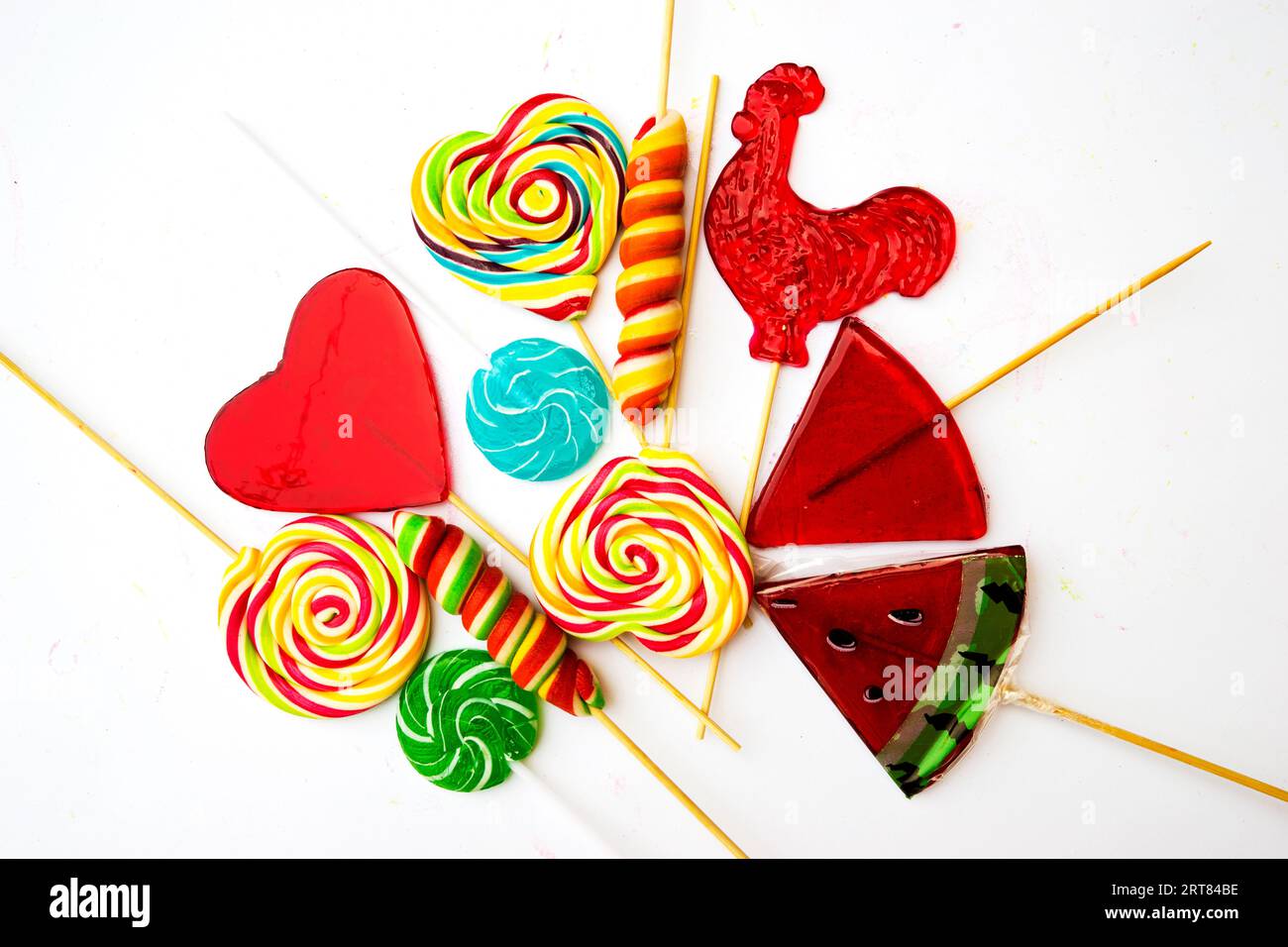 Different candies. Gummy sticks and various lollipops isolated on white ...