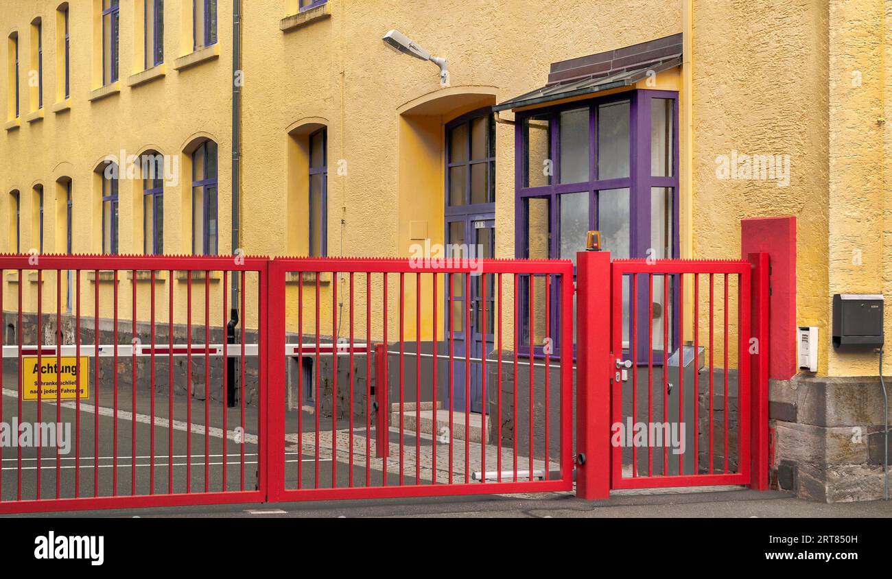 The coloured factory gate Stock Photo - Alamy