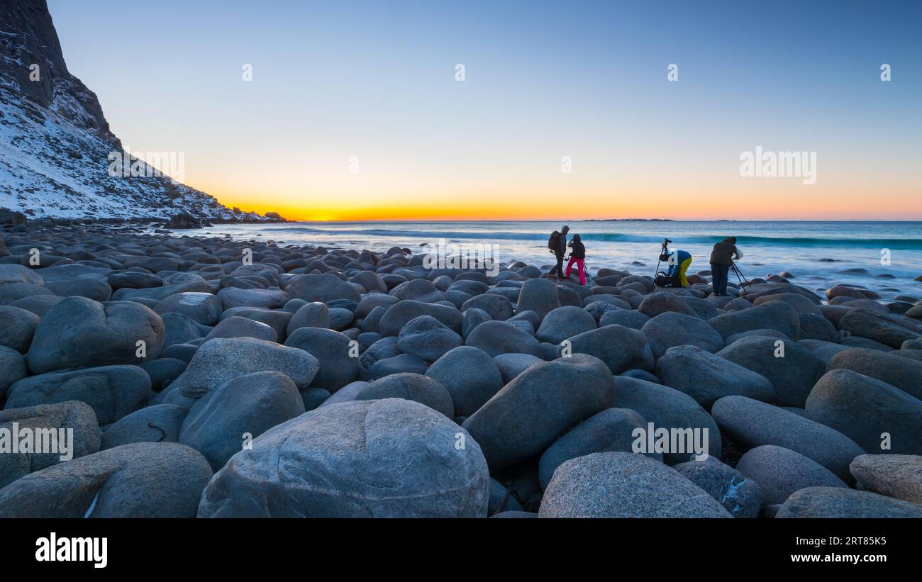 Group of landscape photographers at the famous beach near Uttakleiv ...