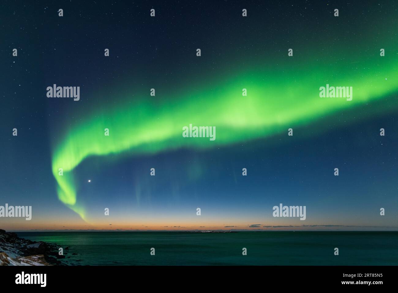 Spectacular dancing green strong northern lights over the famous round ...