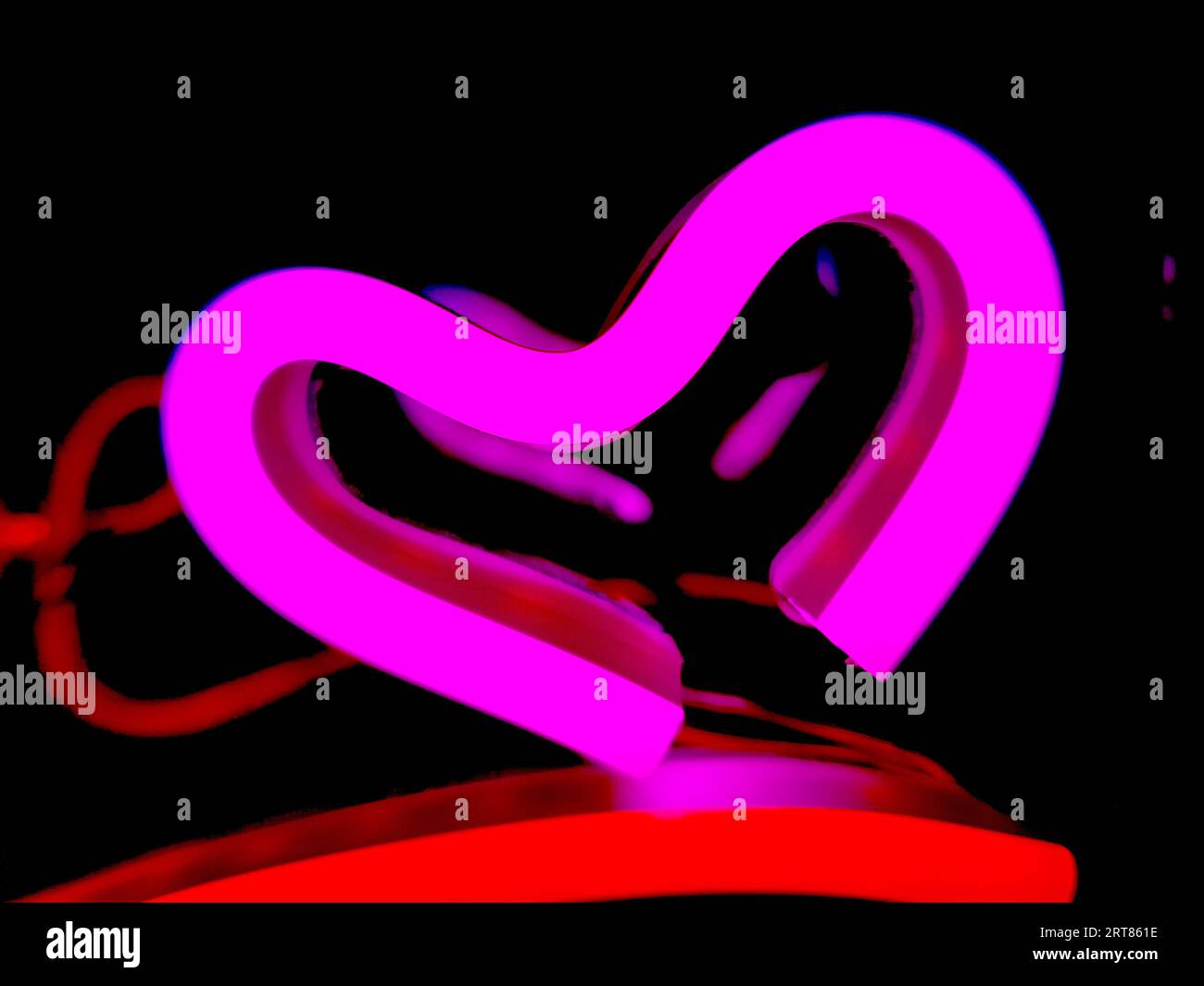 A heart shaped sign in pink Stock Photo - Alamy