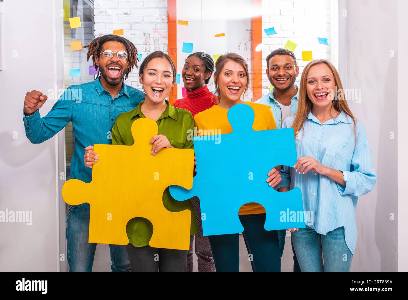Teamwork of partners that work with puzzle as integration and startup ...