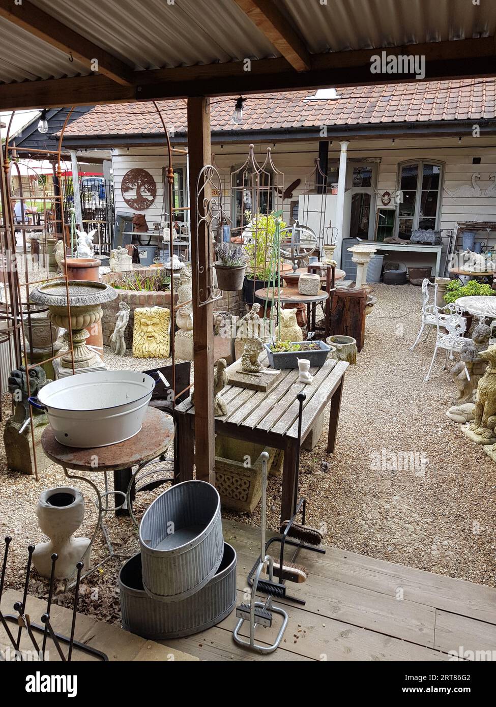 A shop selling antique garden furniture and accessories Stock Photo - Alamy