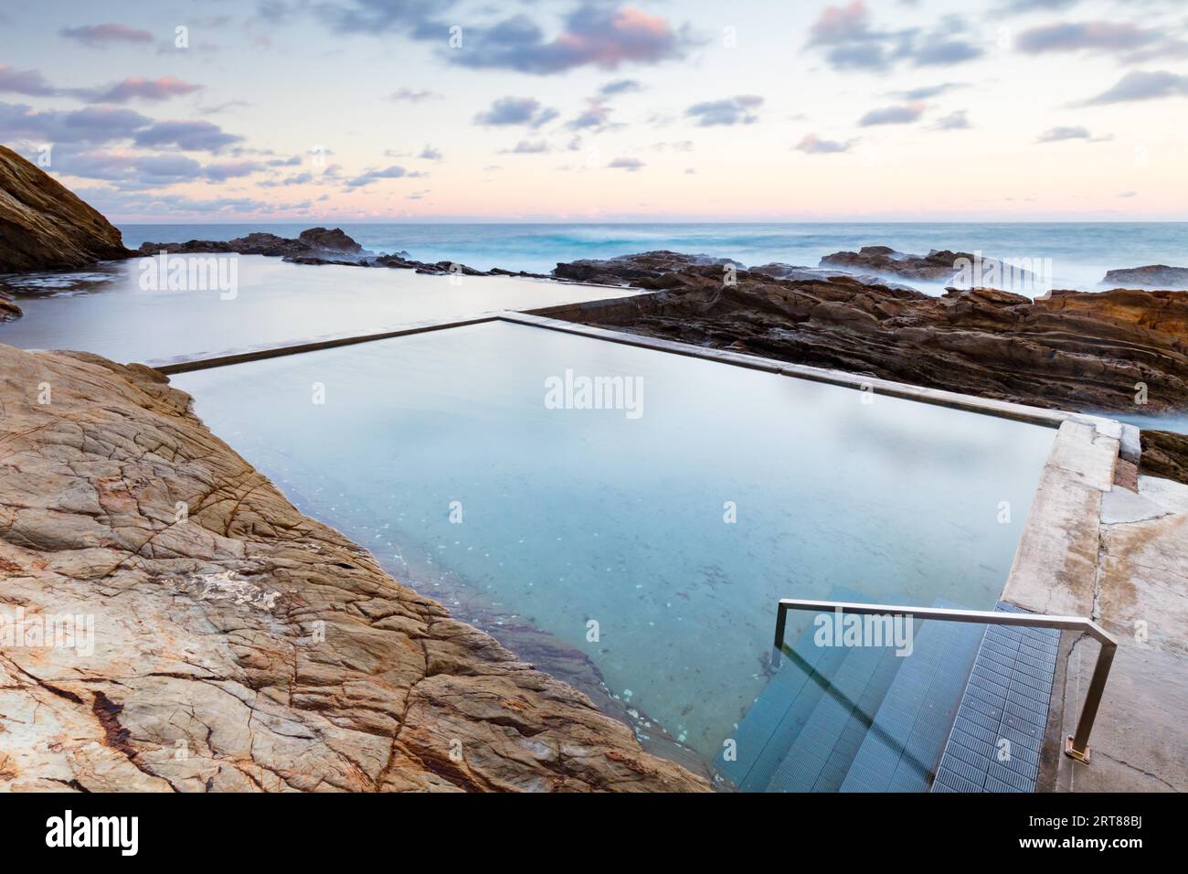 The iconic and famous Blue Pool on a cool autumn evening in Bermagui ...