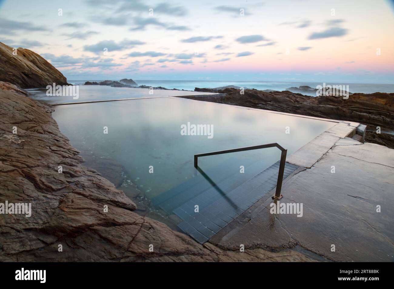The iconic and famous Blue Pool on a cool autumn evening in Bermagui ...
