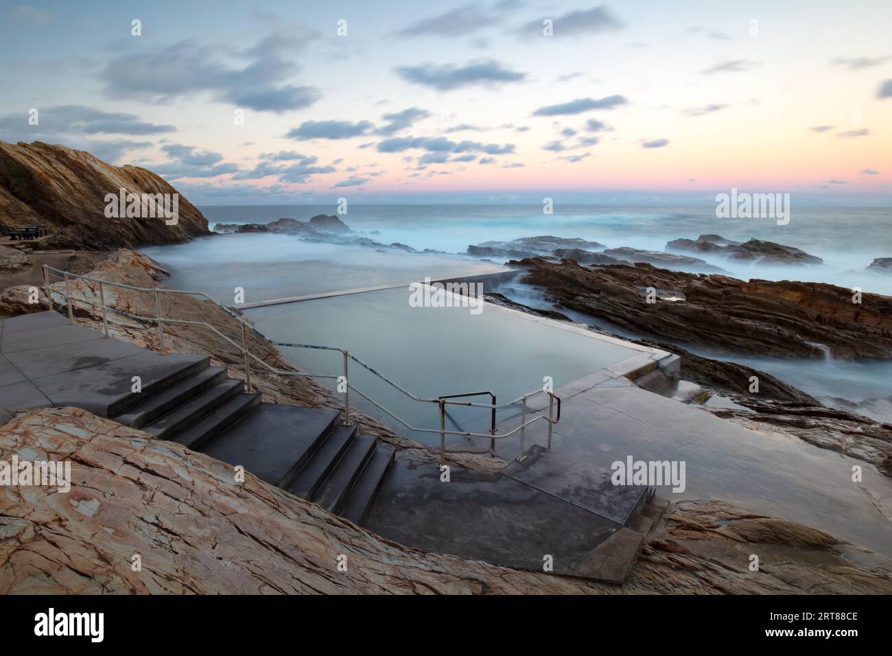 The iconic and famous Blue Pool on a cool autumn evening in Bermagui ...