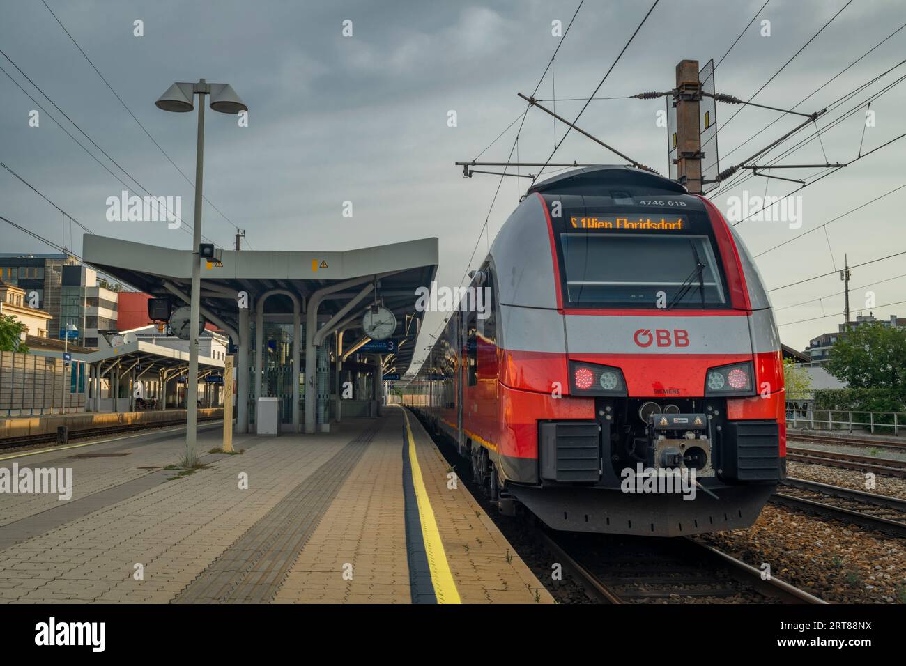 Passenger electric red trains in morning in Liesing in Austria 08 27 ...