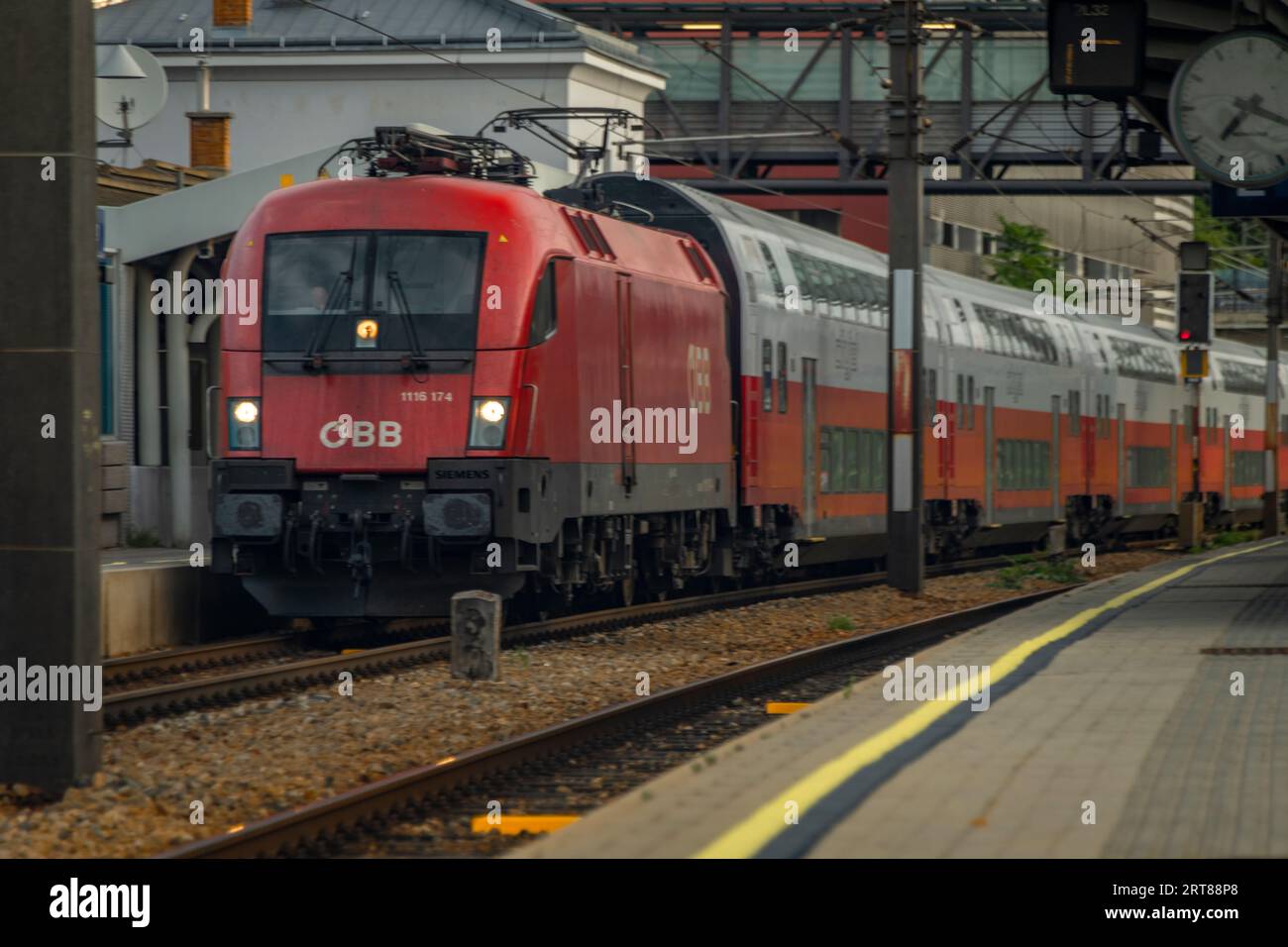 Passenger electric red trains in morning in Liesing in Austria 08 27 ...