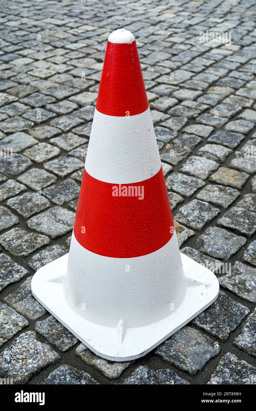 Warning red striped construction emergency cone Stock Photo - Alamy