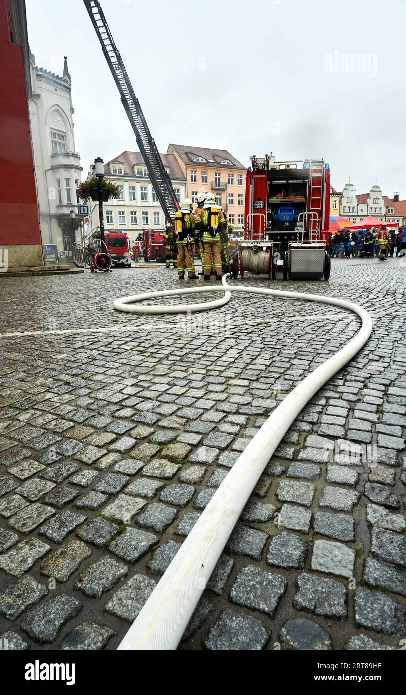 Fire fighter practicing rescue action Stock Photo - Alamy