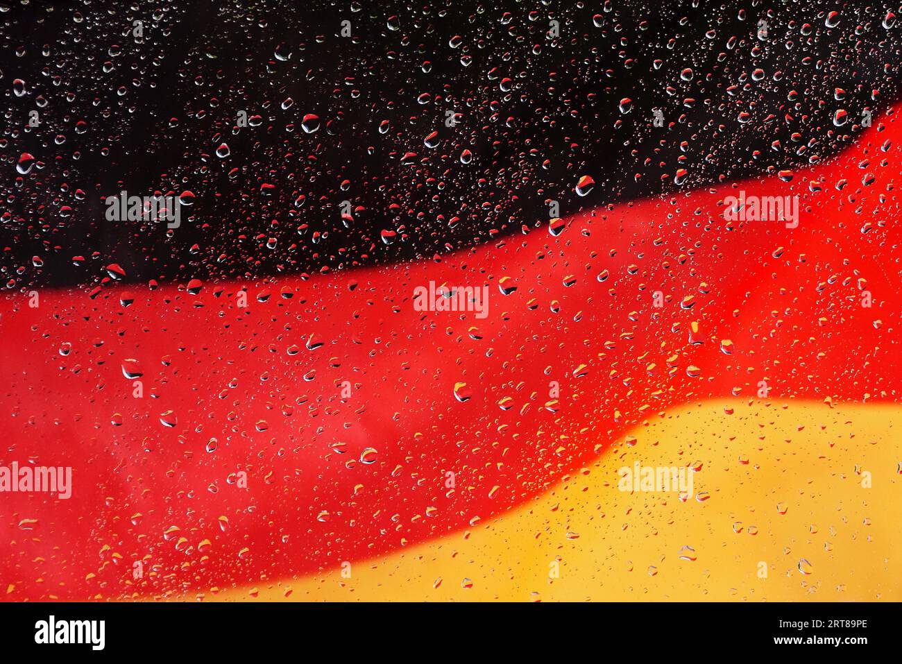 German flag behind rainy window Stock Photo - Alamy
