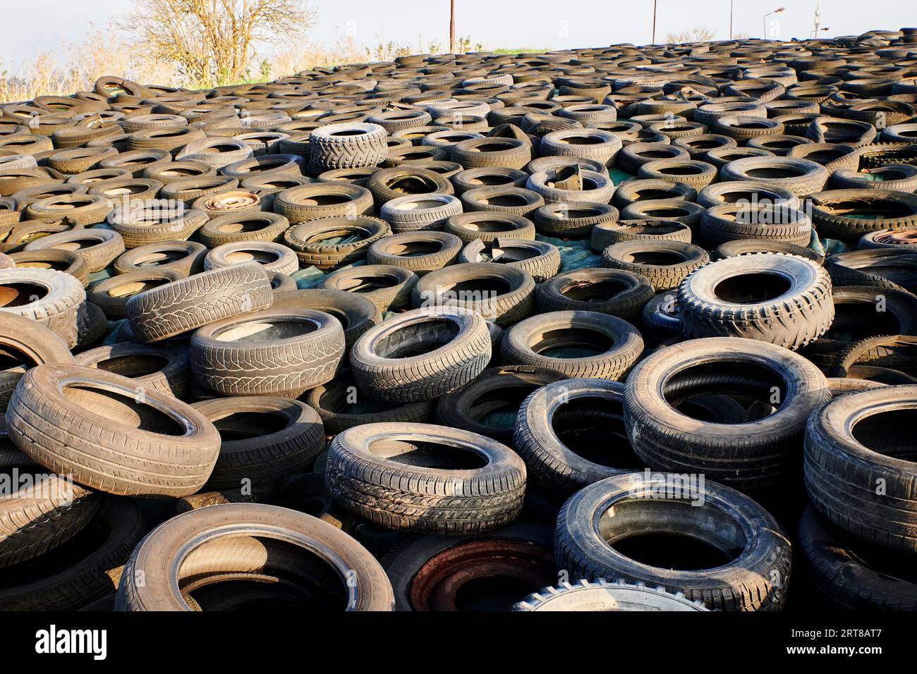 Tons of old used tyres in a mix Stock Photo - Alamy