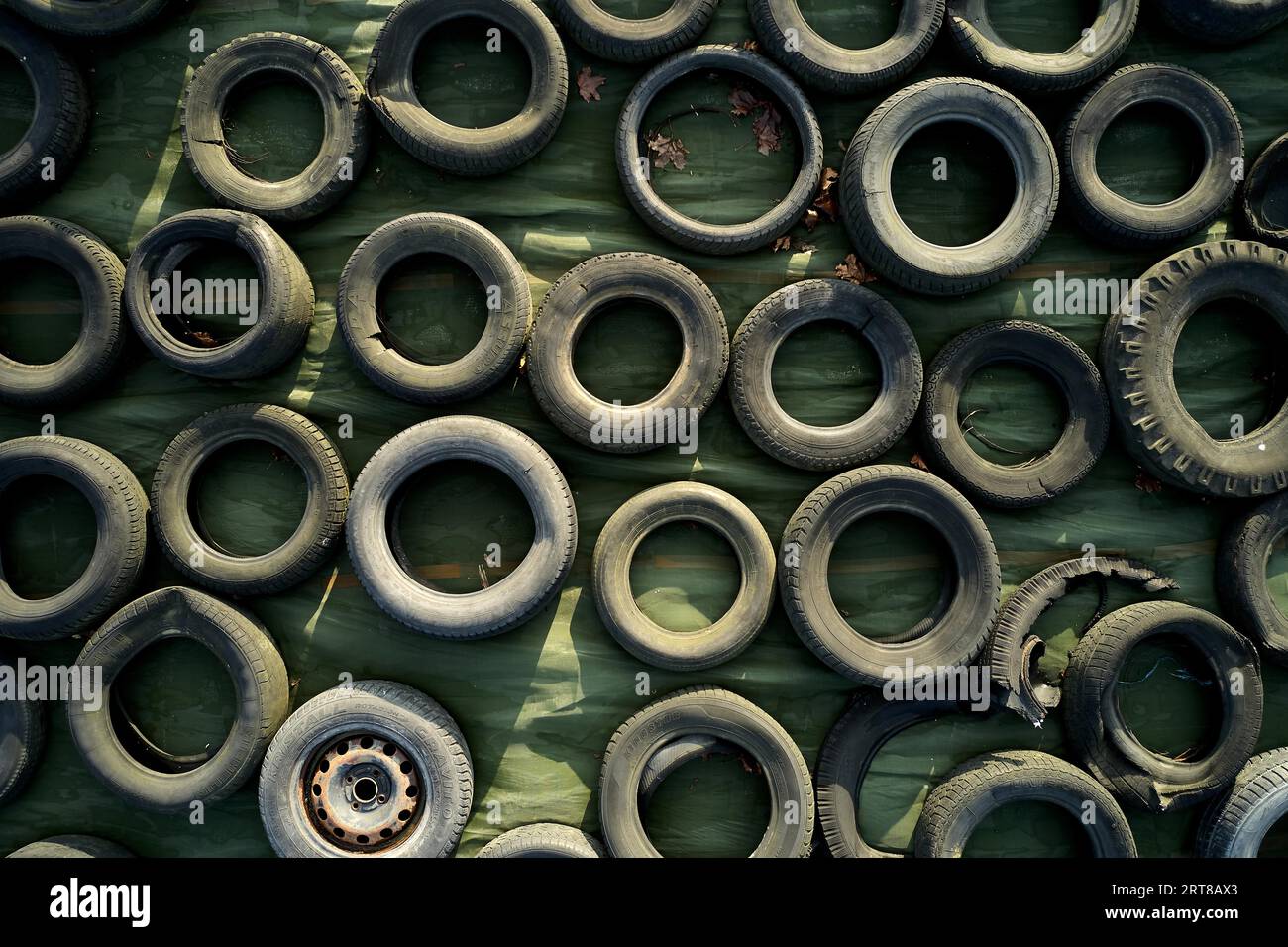 Tons of old used tyres in a mix Stock Photo - Alamy