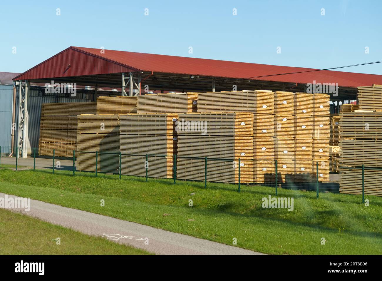 Woodworking plant. Stacked lumber in a warehouse Stock Photo - Alamy