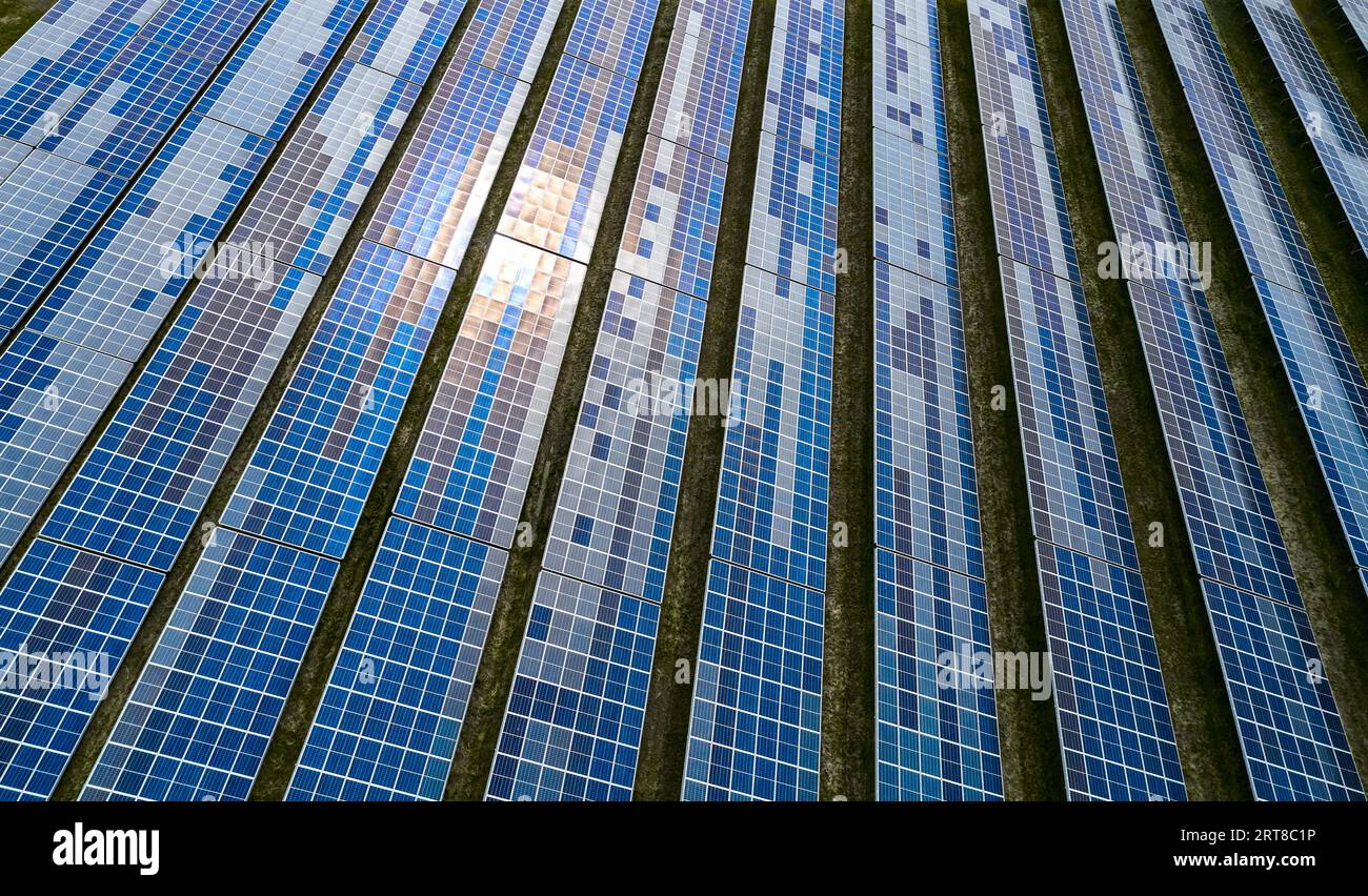 Solar panel field at work with sun reflection Stock Photo - Alamy