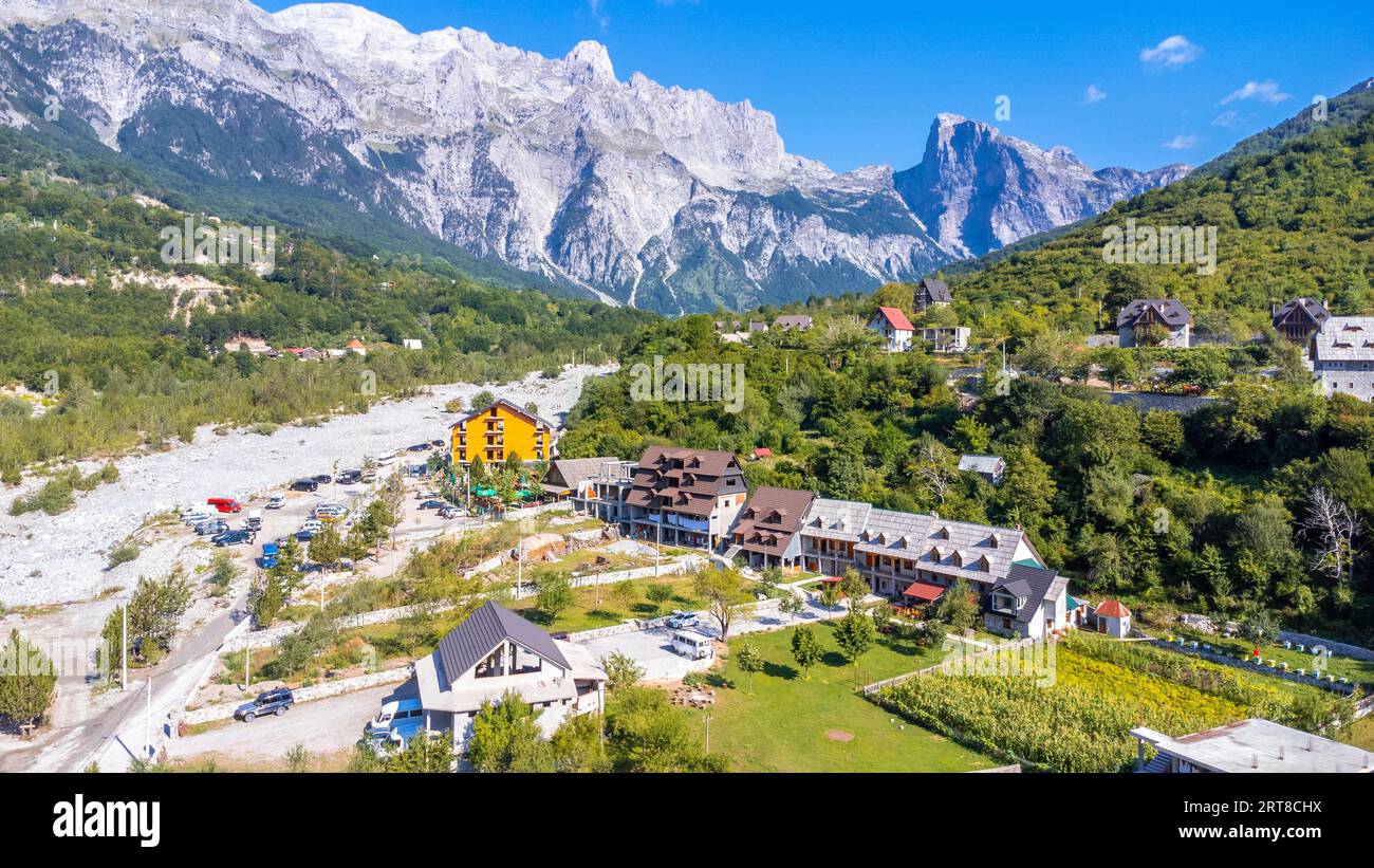 Aerial drone view of the rustic homes and hotels of Theth National Park ...