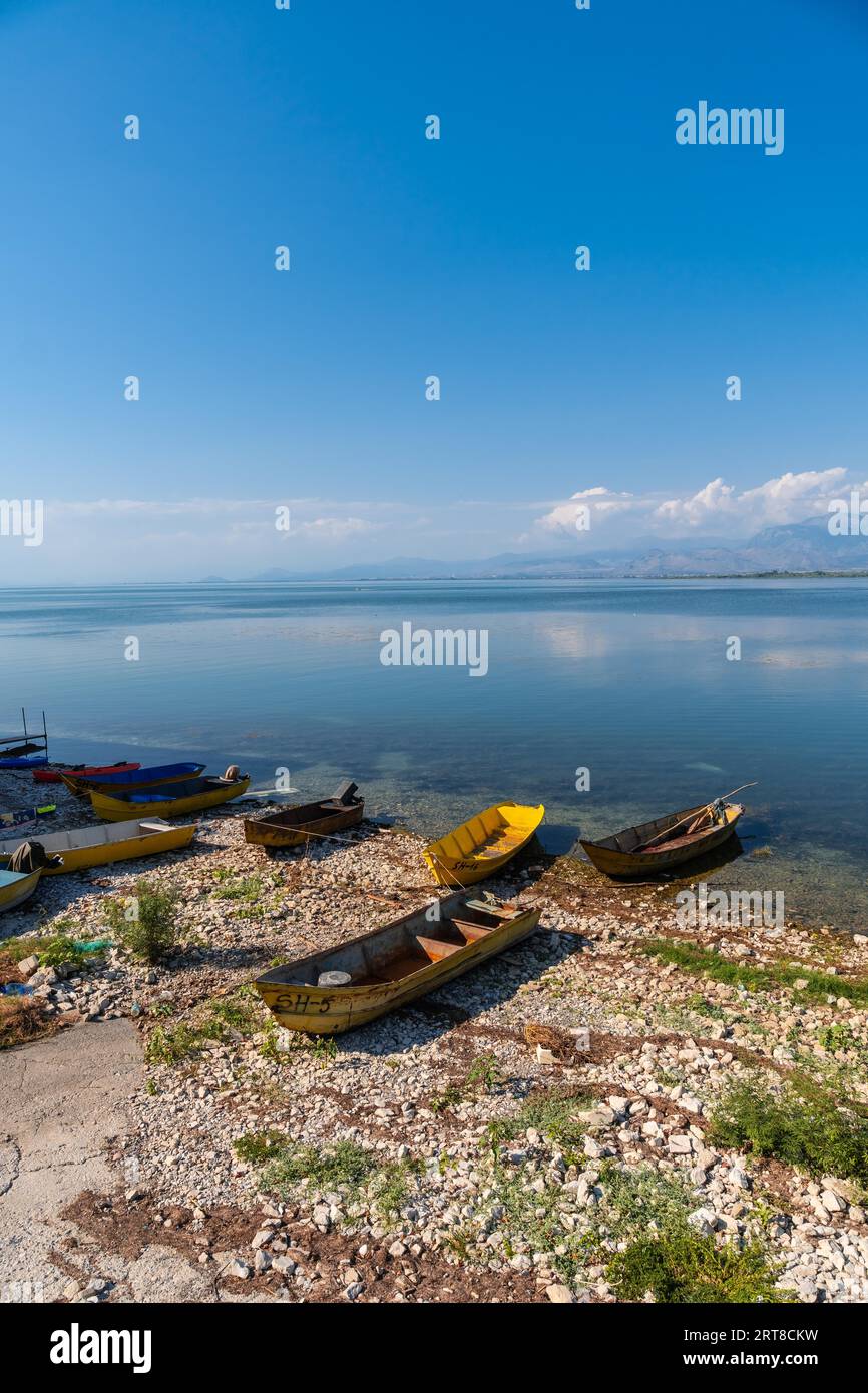Colorful boats in the beautiful landscape in Shiroka on Lake Shkoder. Albania Stock Photo - Alamy