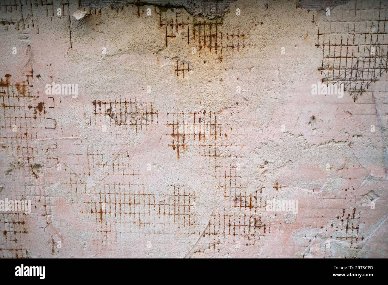 Reinforced concrete with damaged and rusty steel reinforcement. Old ...