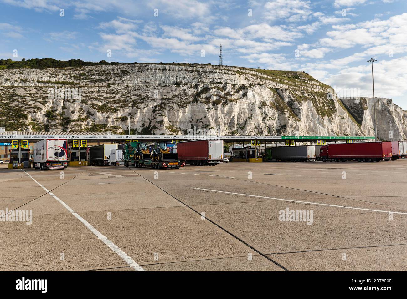 Trucks waiting in the ferry terminal, chalk cliffs, Dover, Kent ...