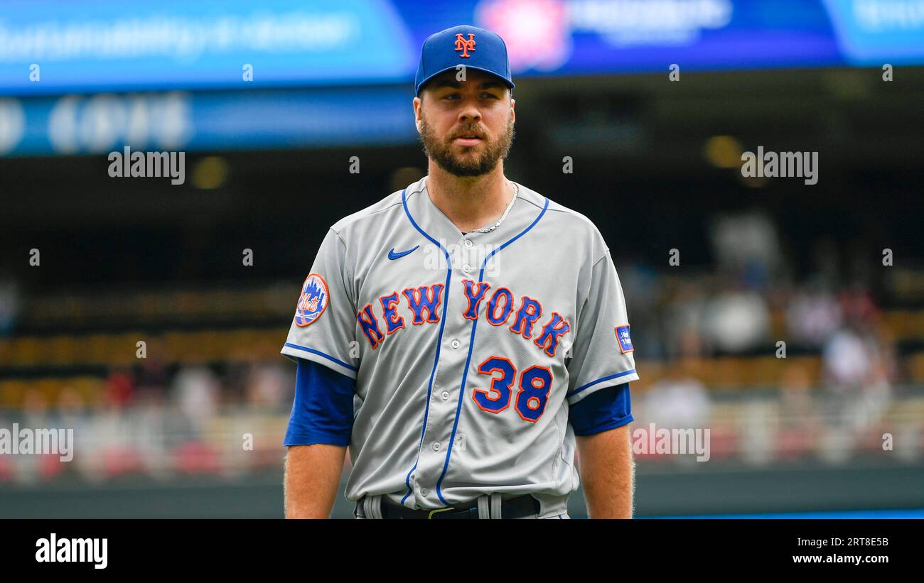 New York Mets pitcher Tylor Megill returns to the dugout after ...