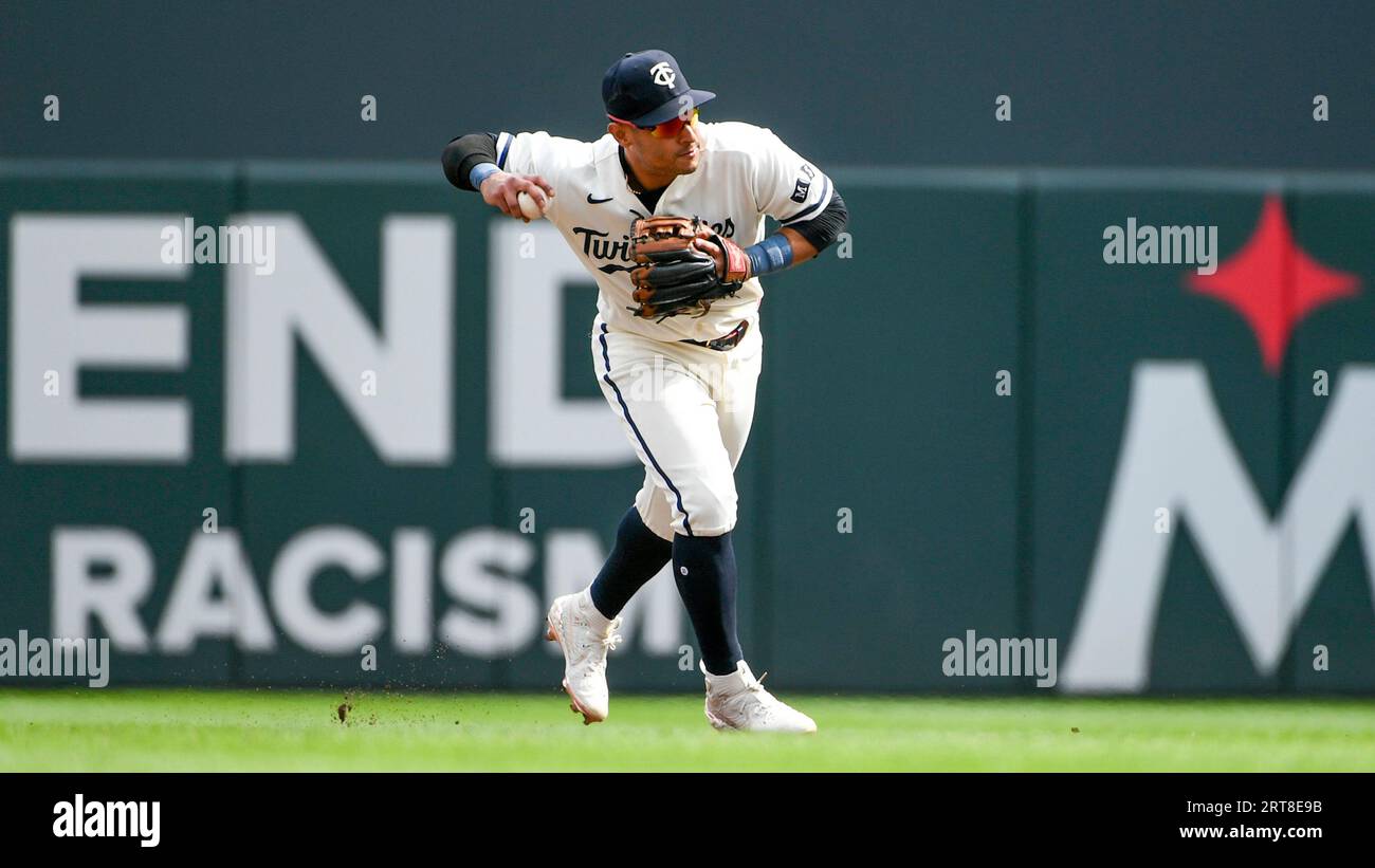 Minnesota Twins second baseman Donovan Solano throws to first for out ...