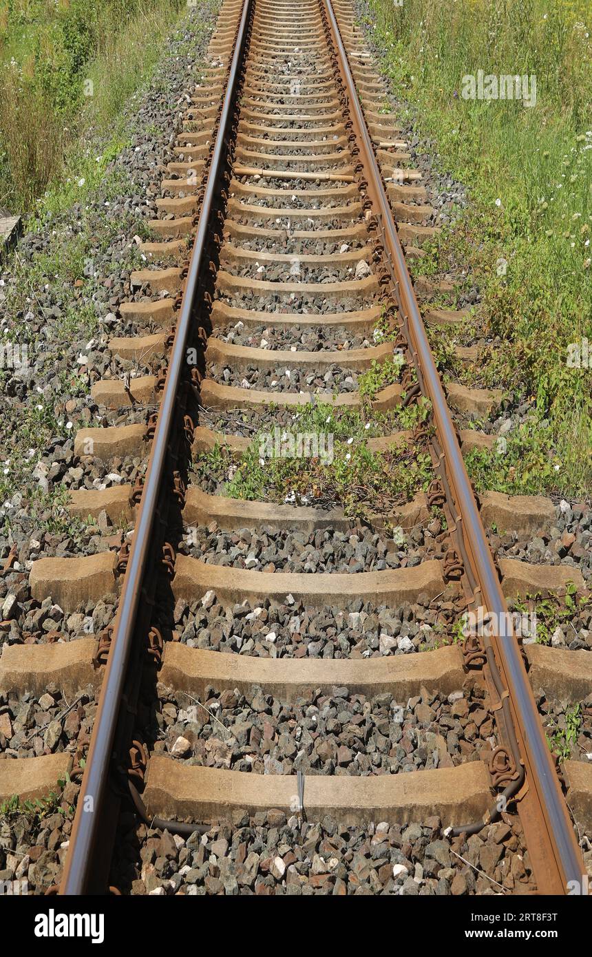 long iron train rail tracks to infinity with no people vertically Stock ...