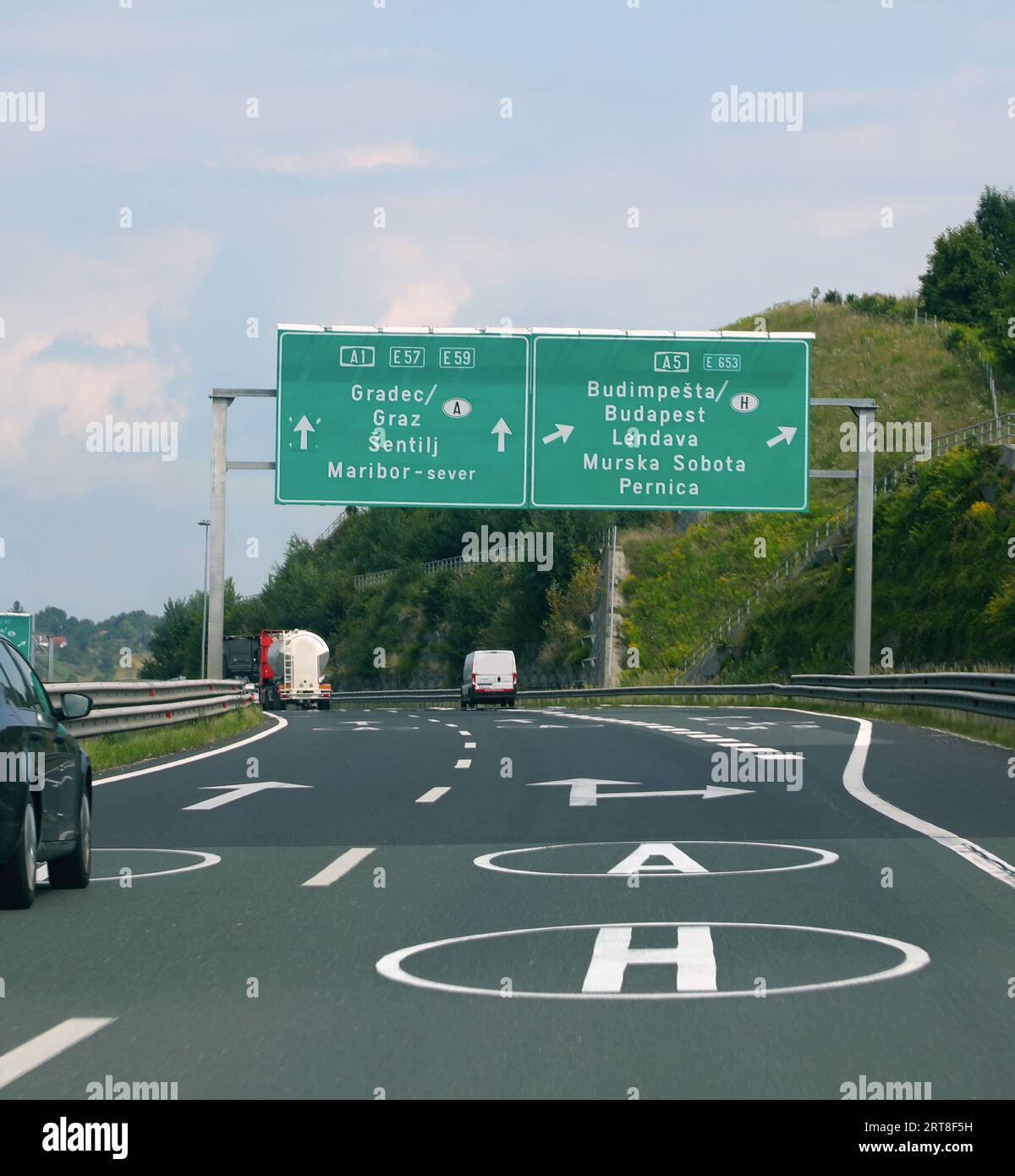 large road signs in the crossroads to Austria or to Hungary with ...