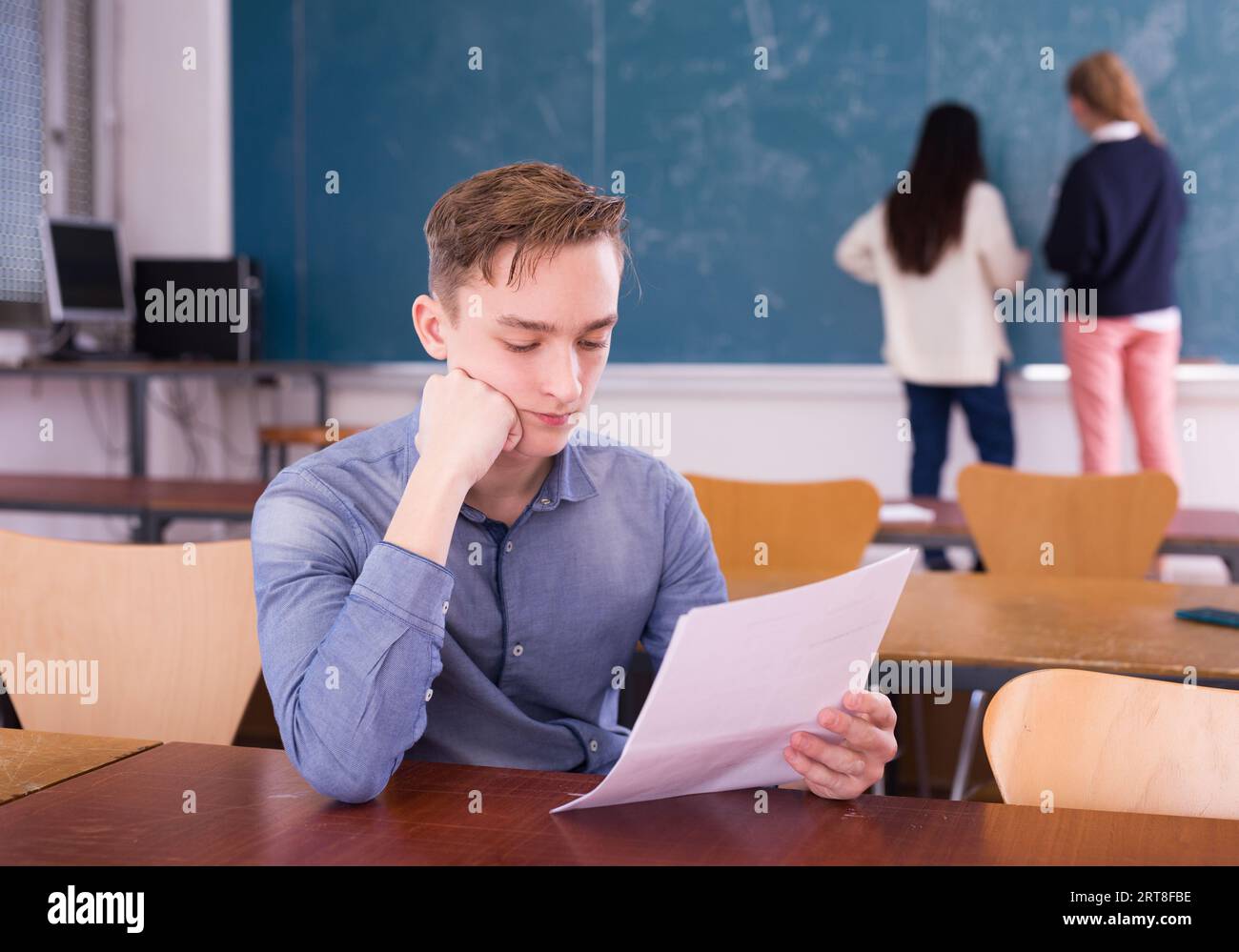 Upset teen student looking at failed exam Stock Photo - Alamy