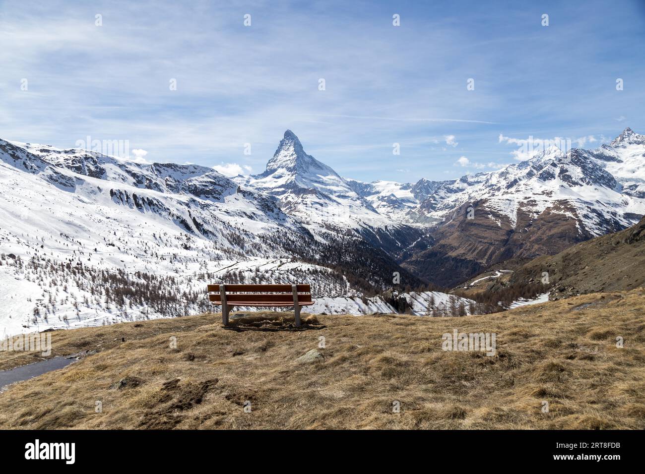 A bench with view of the Swiss Alps with the famous Matterhorn Stock ...