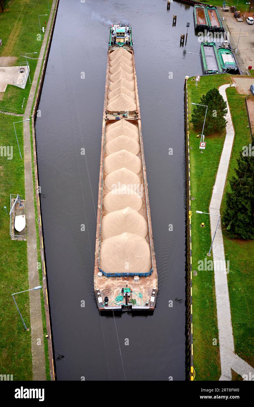 Sand transport by boat on river Stock Photo - Alamy