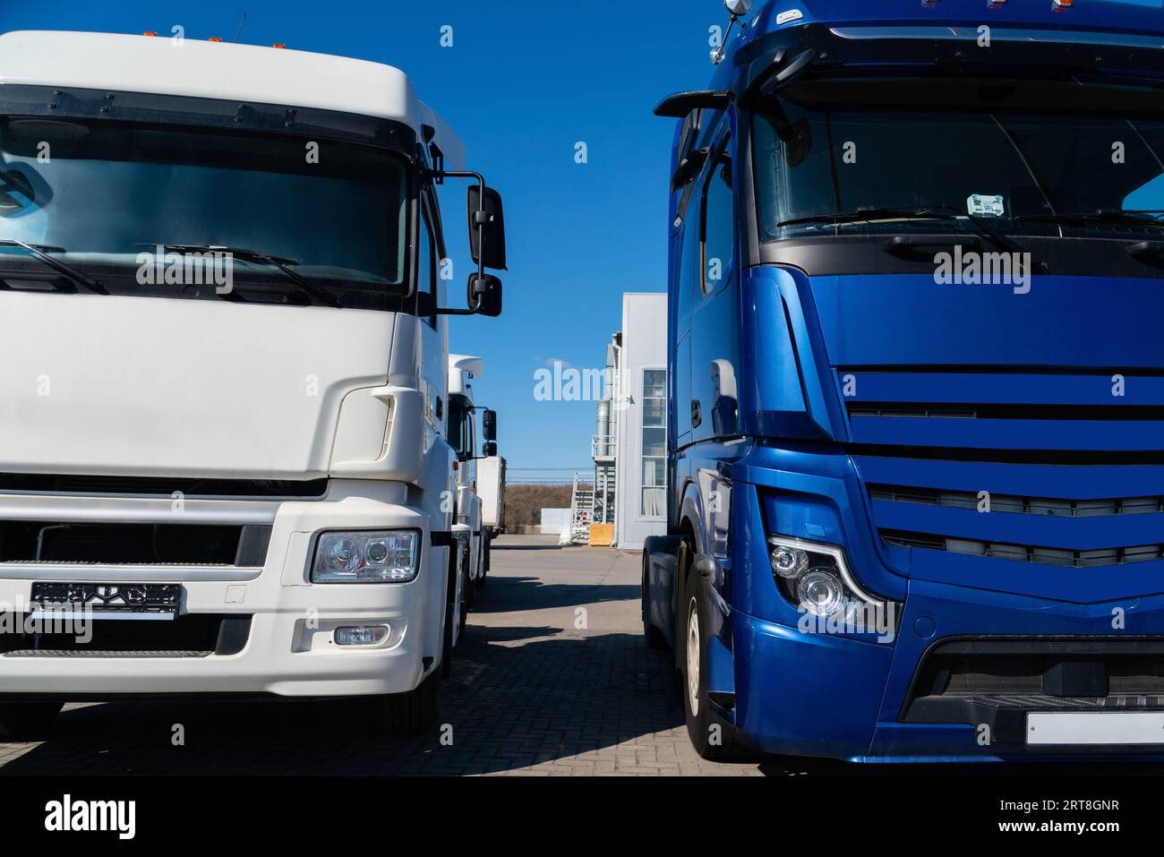 Semi truck fleet at the logistics center Stock Photo - Alamy