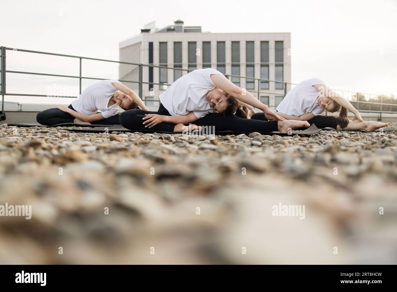 Young woman deep stretch in hi-res stock photography and images - Alamy