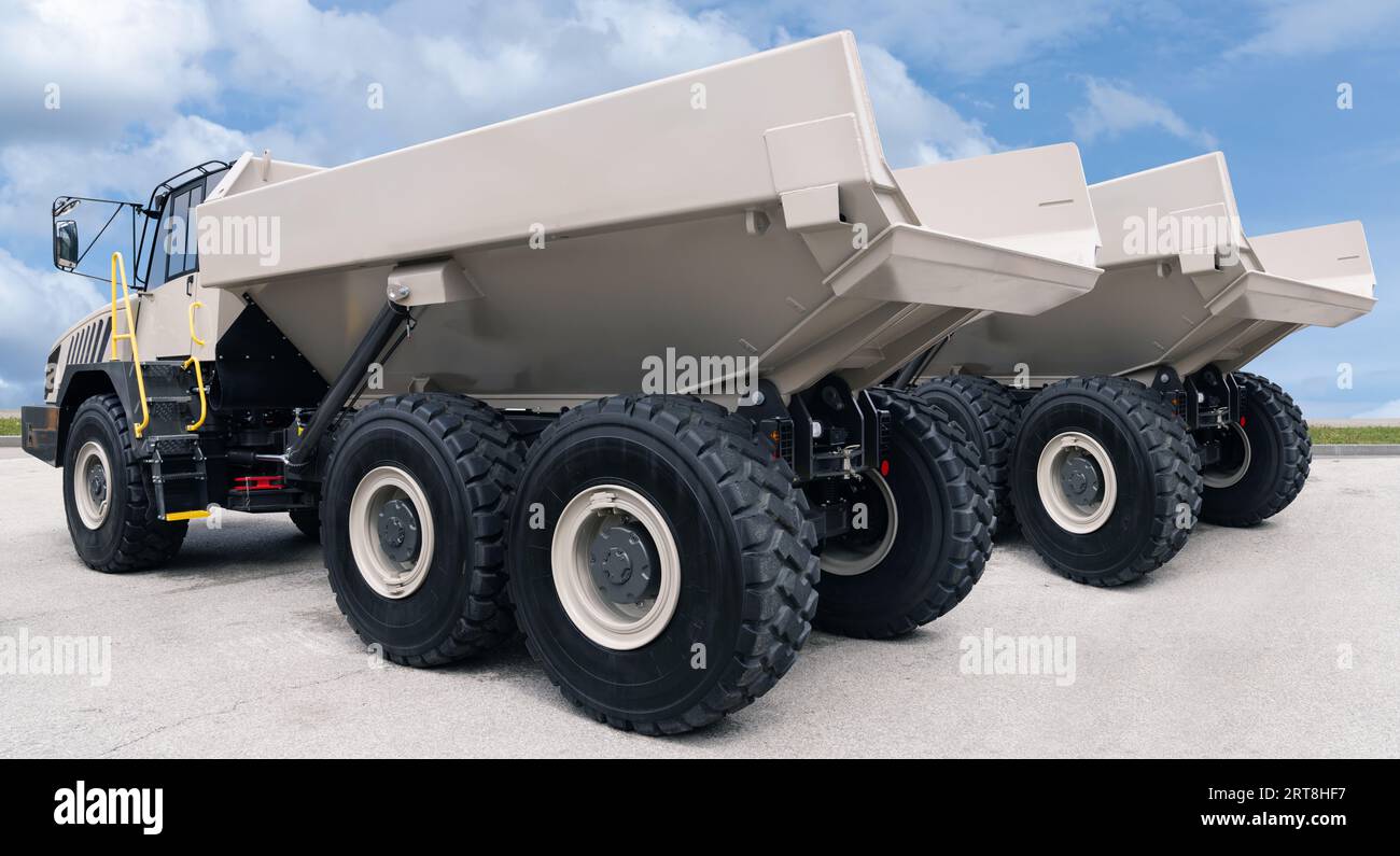 Two heavy mining truck. Back view Stock Photo - Alamy