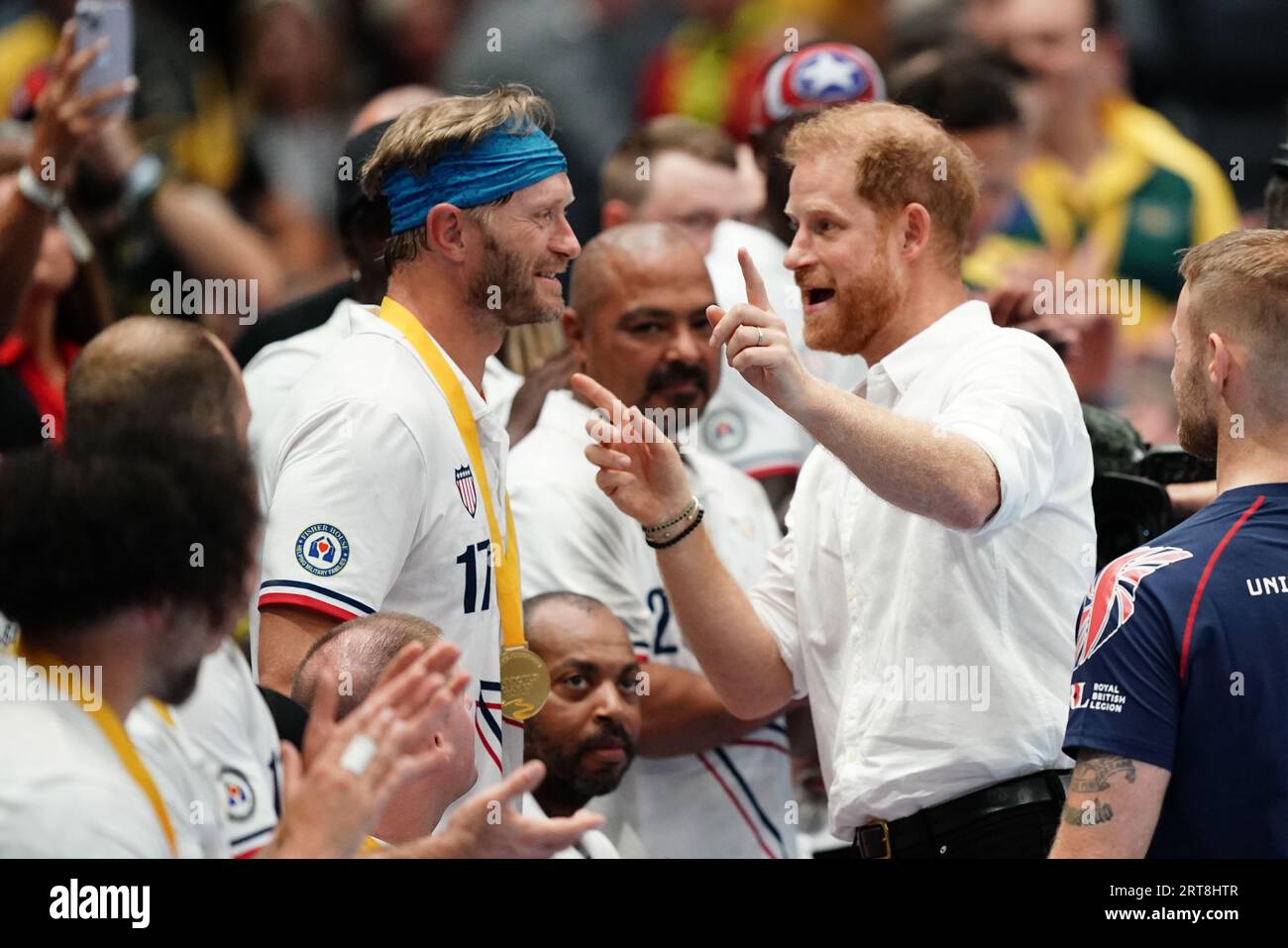 The Duke of Sussex (right), presents medals during the wheelchair rugby ...