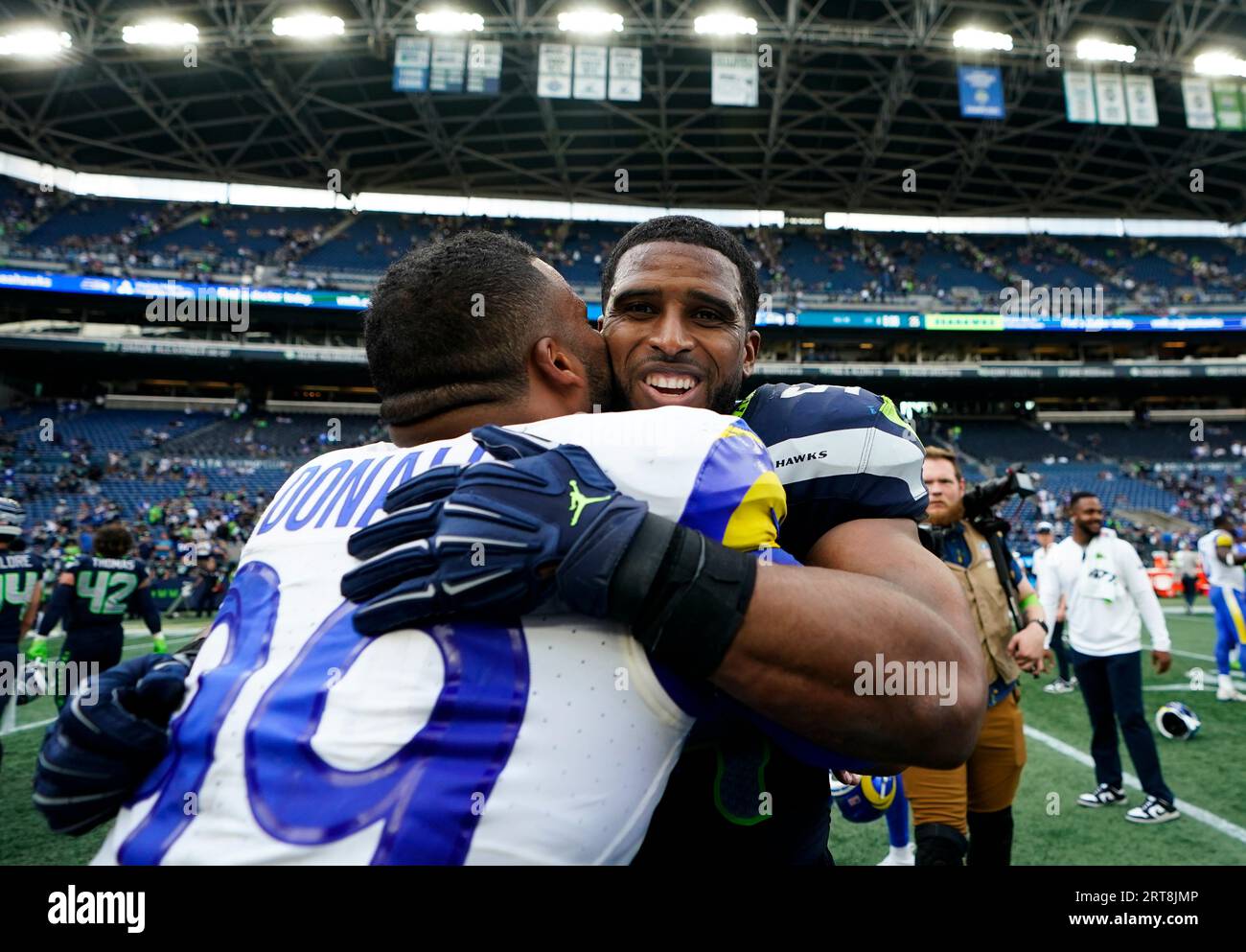 Los Angeles Rams defensive tackle Aaron Donald (99) hugs former ...