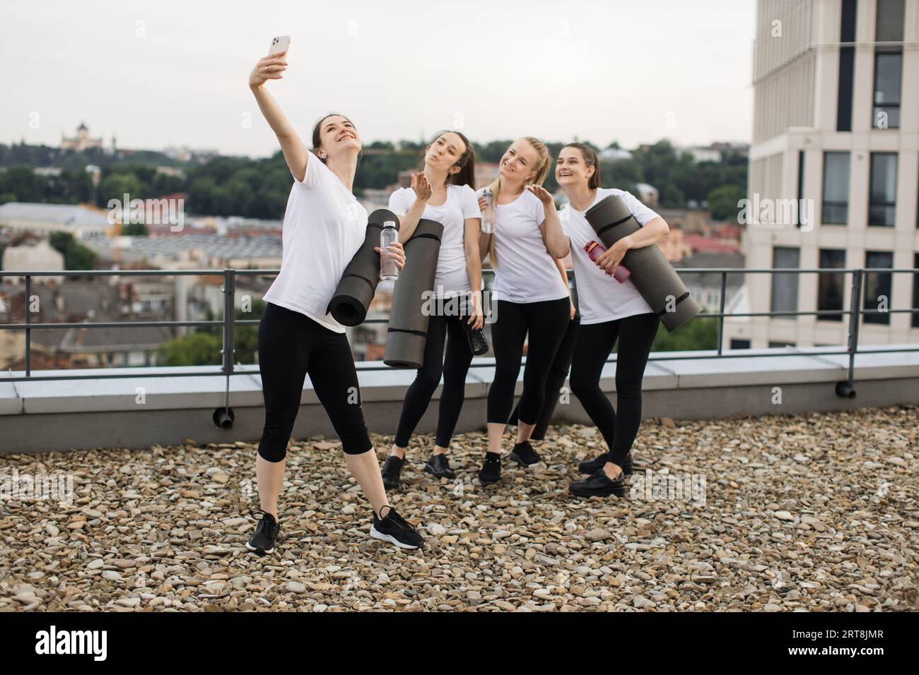 Group yoga class on terrace hi-res stock photography and images - Alamy