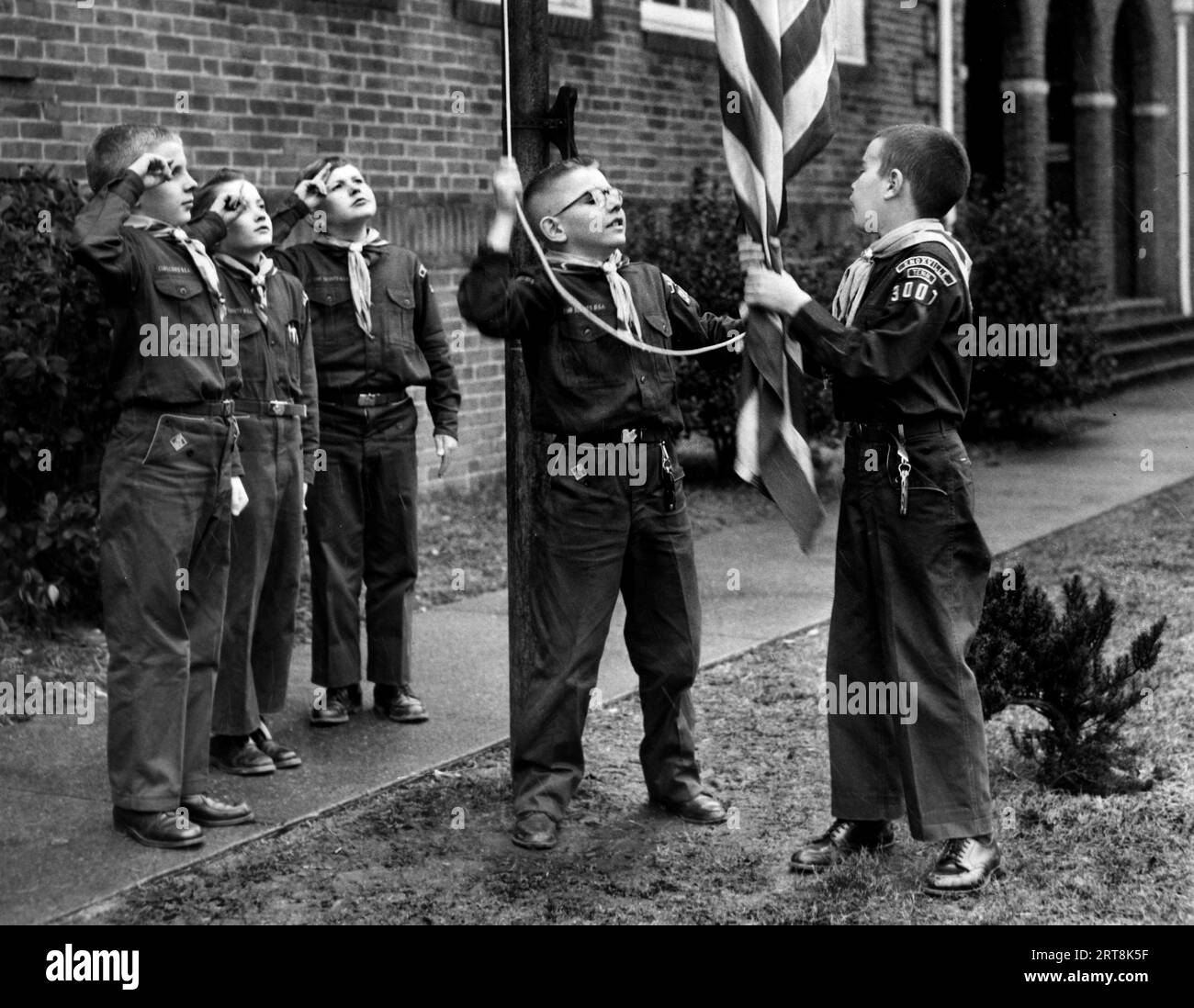 Young members of a Cub Scout den participate in a U.S. flag-raising ...