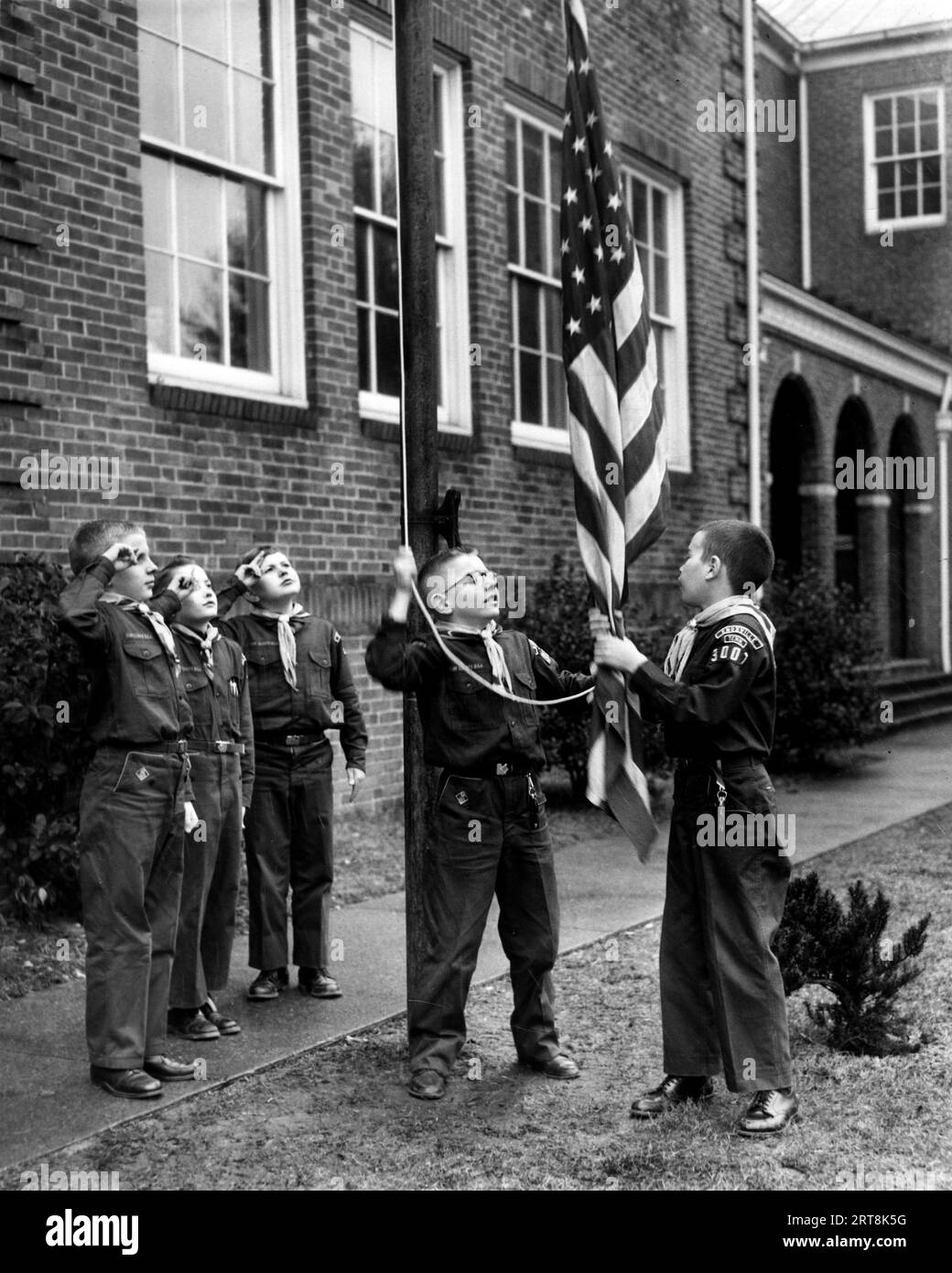 Young members of a Cub Scout den participate in a U.S. flag-raising ...