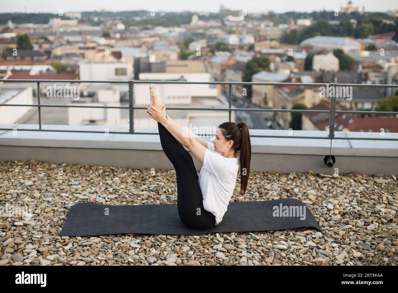 Female practitioner lifting chest and legs in yoga pose Stock Photo - Alamy
