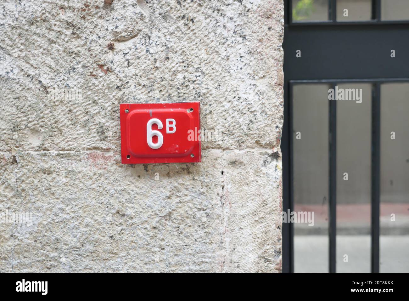 house number six. Decorative lettering on a brick wall Stock Photo - Alamy