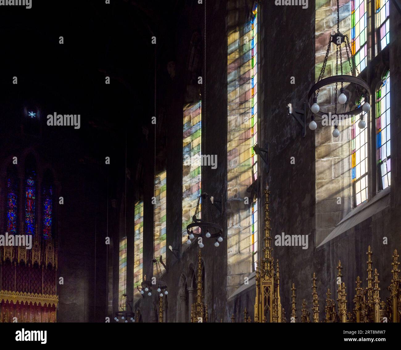 Interior of abandoned church with stained glass window reflections ...
