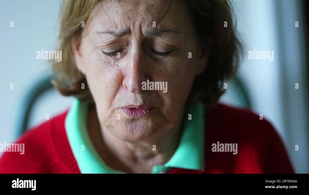 Sad Senior woman close-up face with exaggerated emotional expression of ...