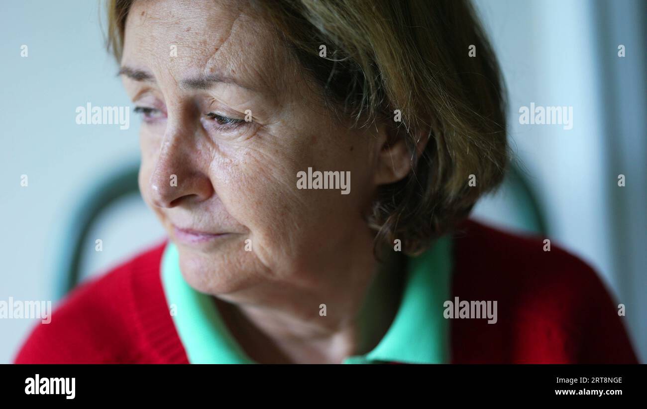 Sad Senior woman close-up face with exaggerated emotional expression of ...