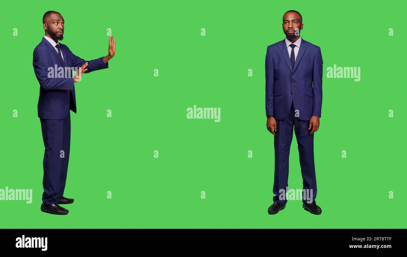 Negative businessman doing stop sign with palm raised, showing ...