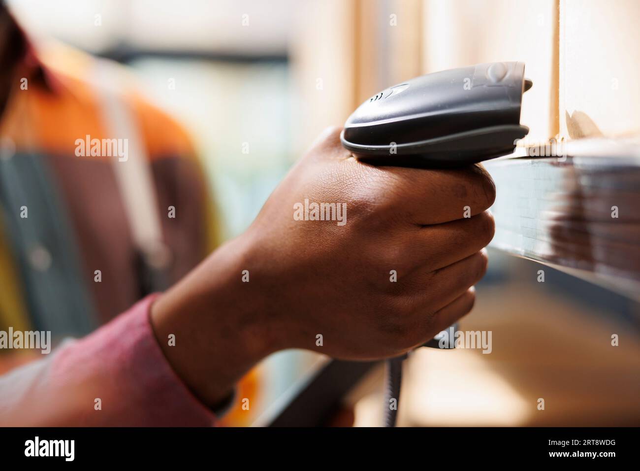 African american man hand holding barcode scanner in industrial ...