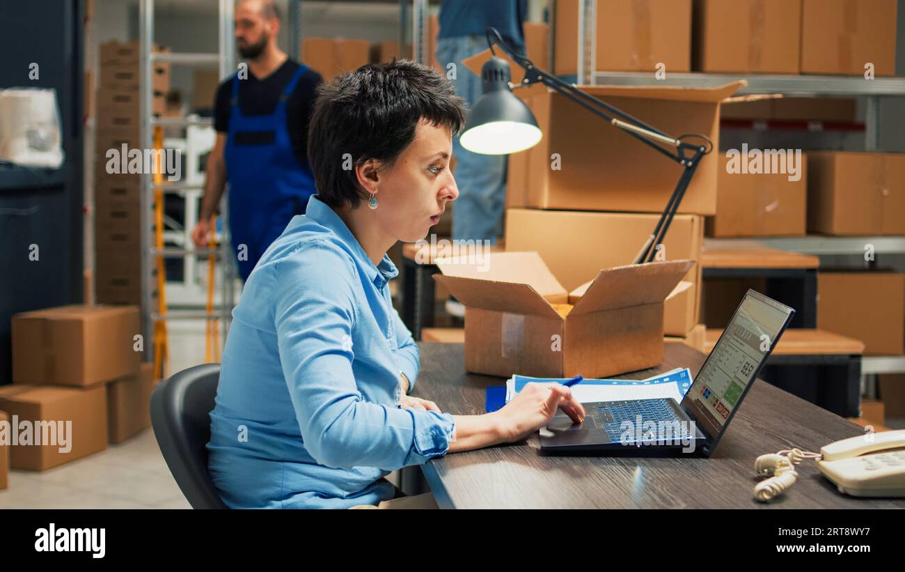 Small business owner preparing merchandise shipment from storehouse ...